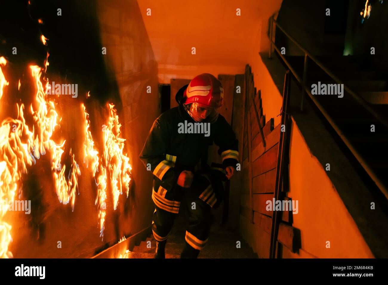 Brave Fireman going upstairs to save and rescue people in a Burning ...