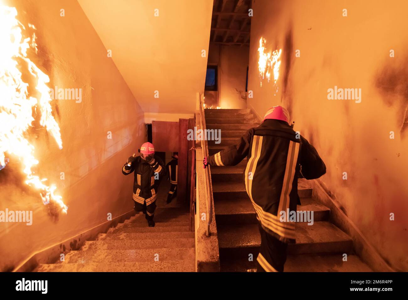 Brave Fireman going upstairs to save and rescue people in a Burning ...