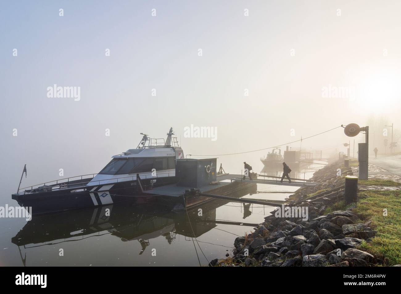Wien, Vienna: mist at river Donau (Danube), staff emtering boat of ...