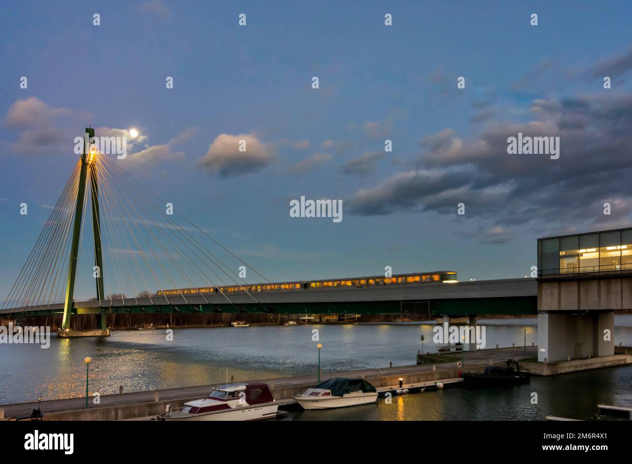 Wien, Vienna: full moon above river Donau (Danube), train of subway ...
