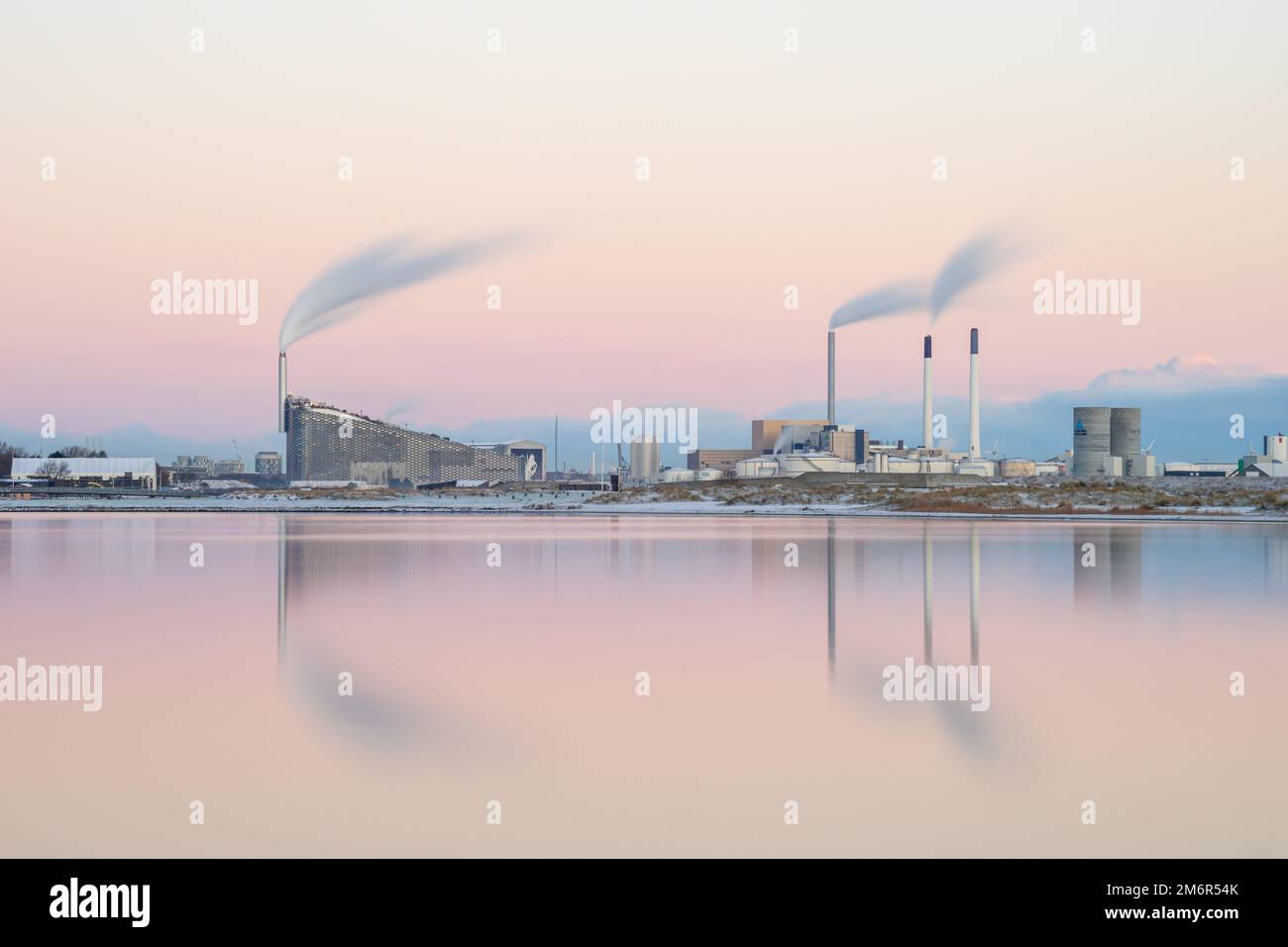 Industrial plants in Amager, Copenhagen, Denmark. Amager Bakke, left ...