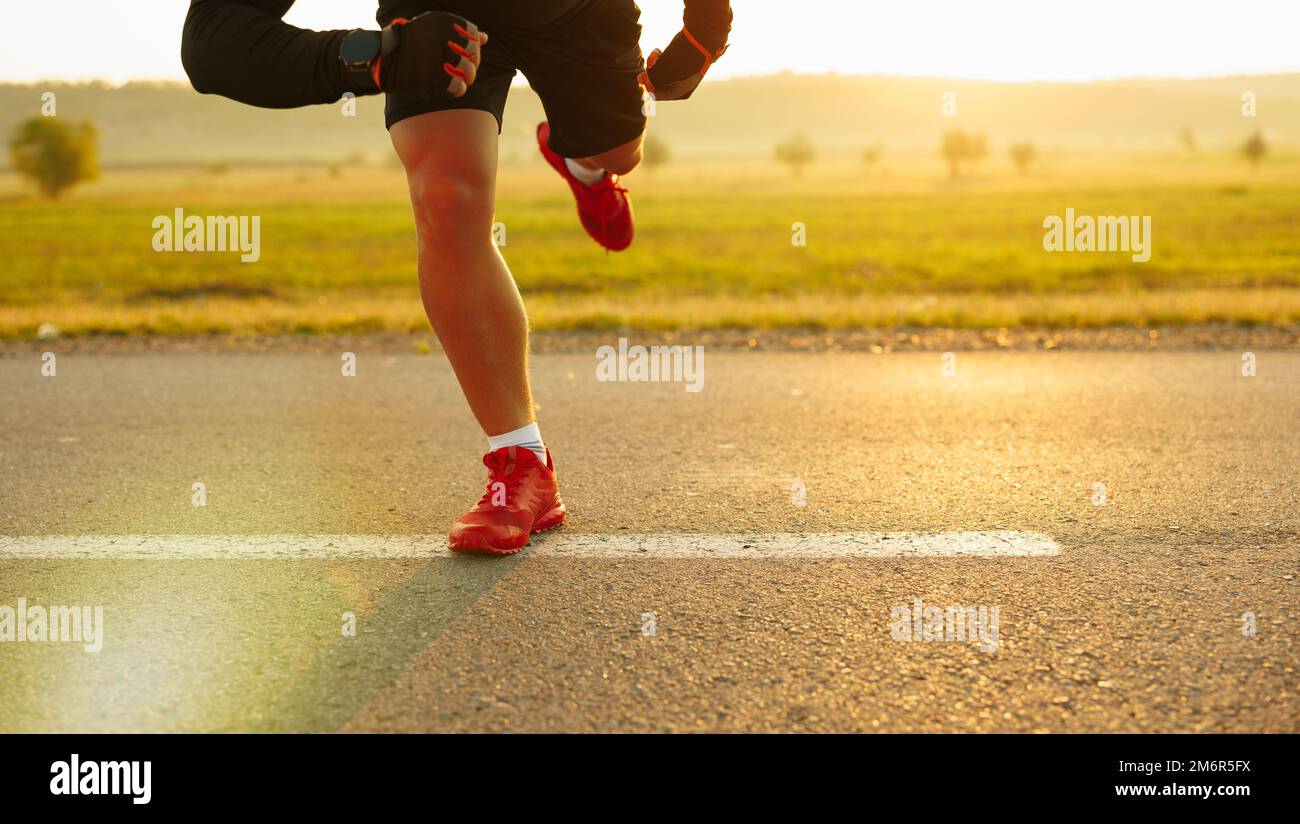 Detailed view of a sprinter getting ready to start. Selective focus ...