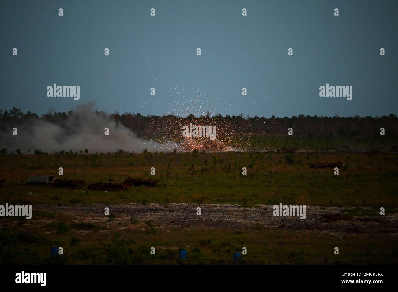 An explosion from a 105mm artillery round fired by an AC-130J ...