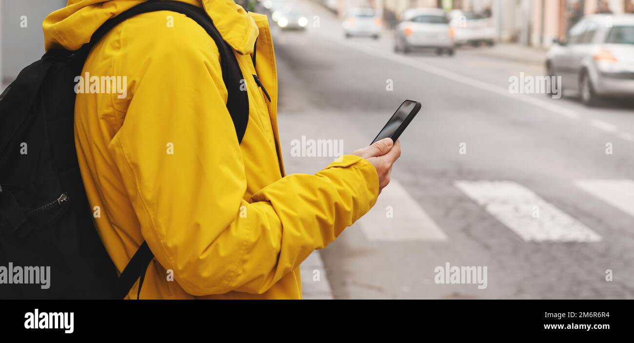 Person with yellow jacket hi-res stock photography and images - Alamy