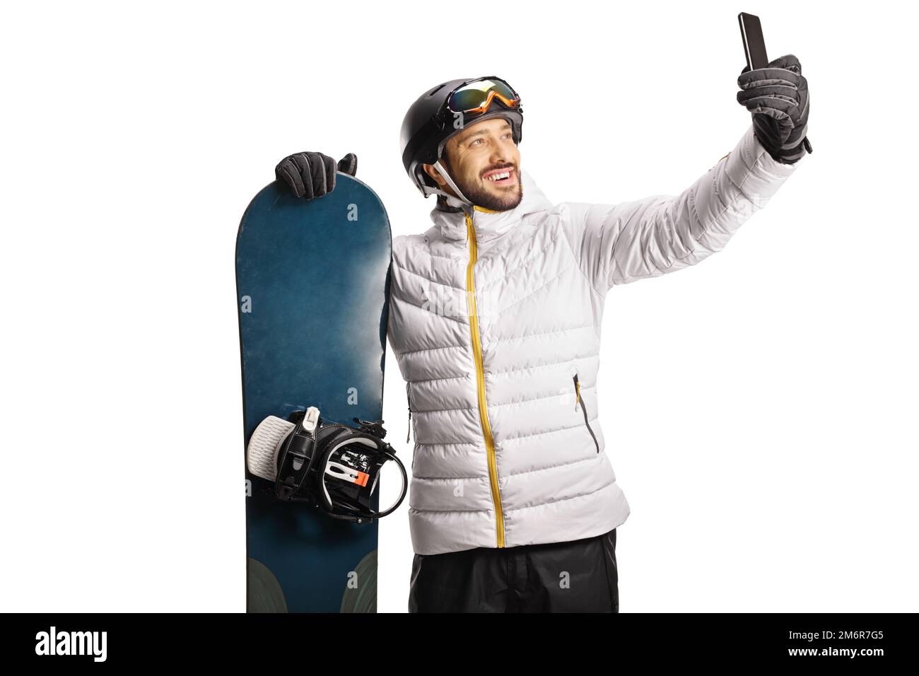 Man with a snowboard taking a selfie with a smartphone isolated on ...