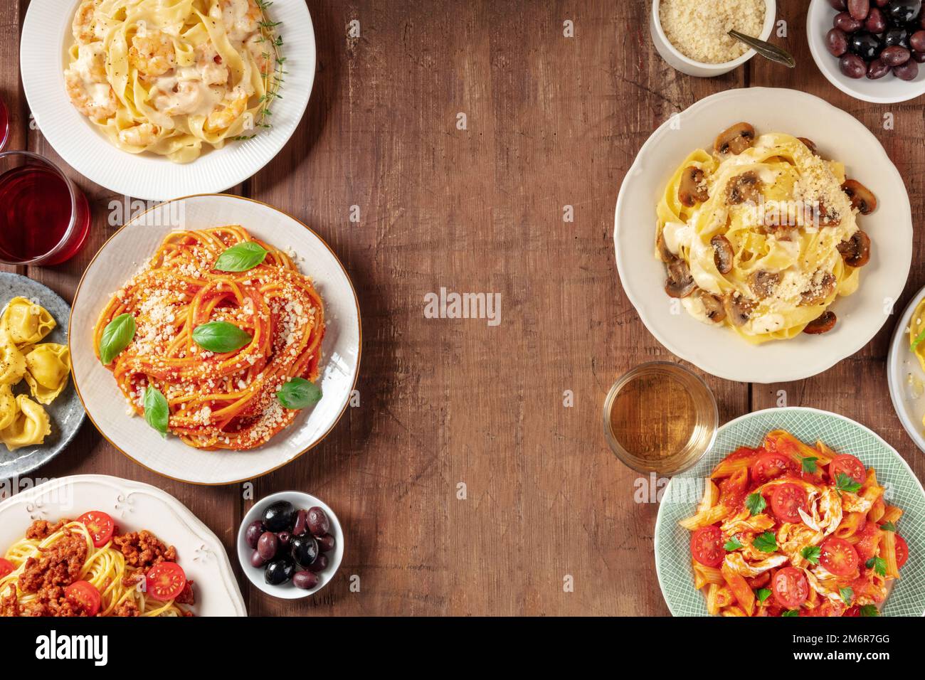 Italian pasta dishes forming a frame for copy space, overhead flat lay ...