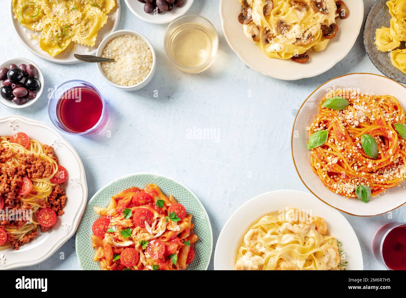 Italian pasta dishes forming a frame for copy space, overhead flat lay ...