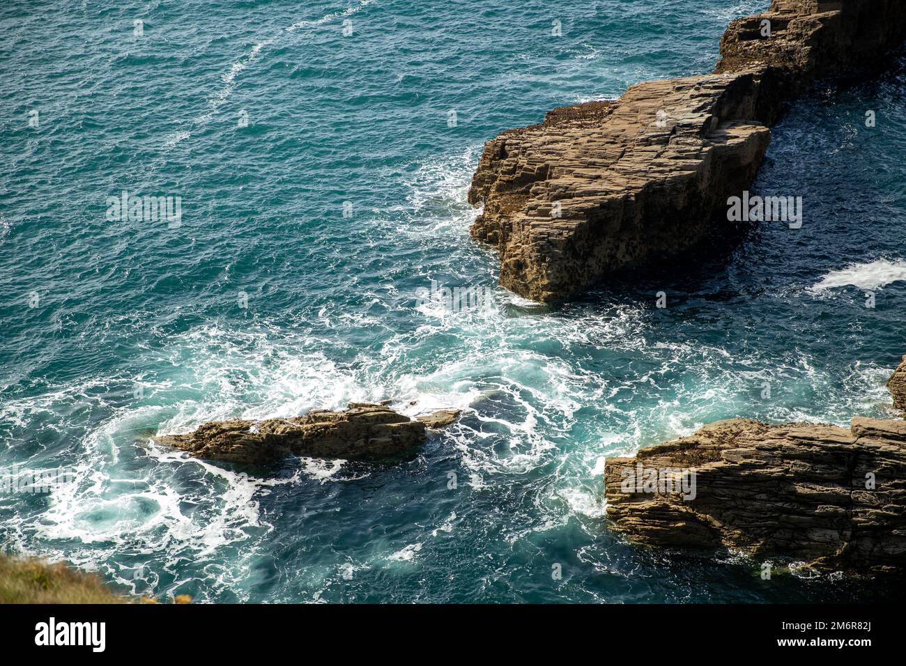 A bird's eye view of rocks in the ocean Stock Photo - Alamy