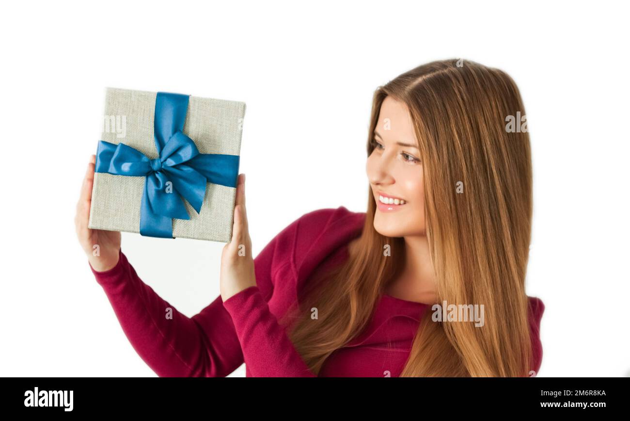 Christmas holiday present, happy woman holding a gift or luxury beauty ...