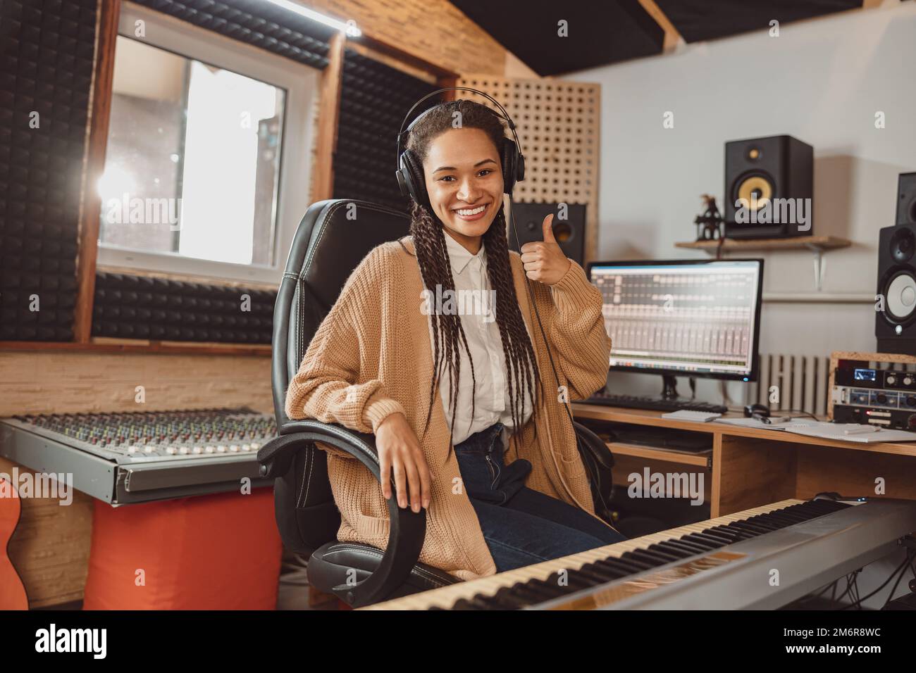 Gorgeous stylish African woman audio engineer, musician and producer ...