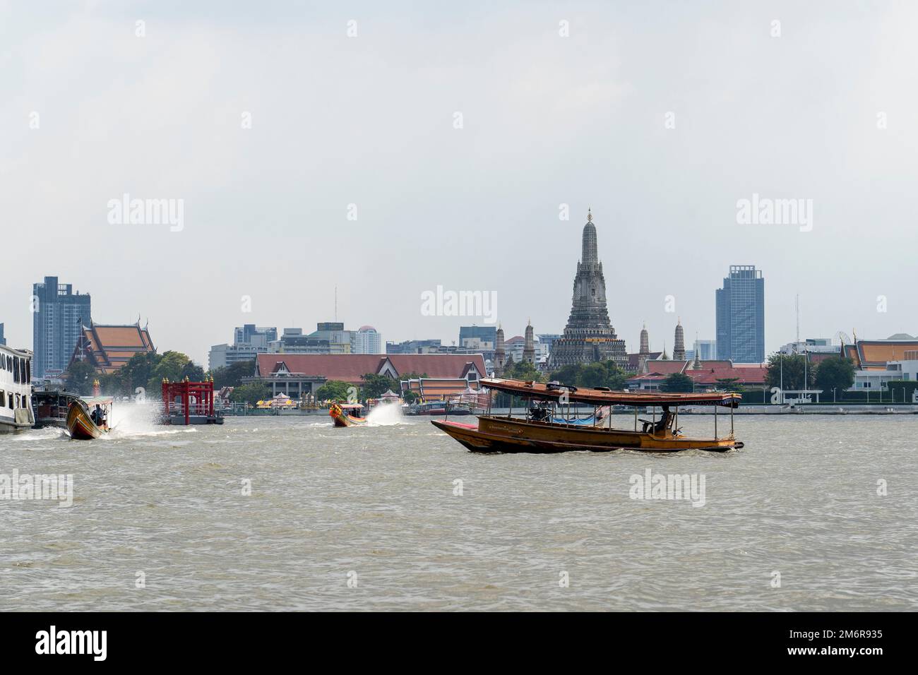 Wat Arun with the Chao Phraya River as foreground in Bangkok, Thailand ...