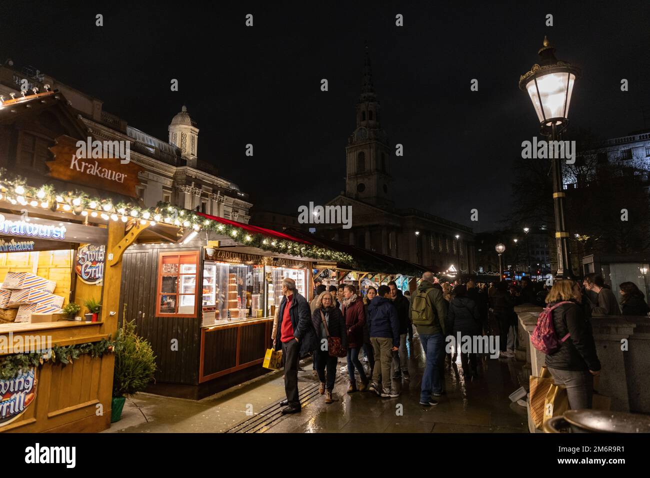 Christmas shoppers make their way through the Xmas Markets on Trafalgar ...