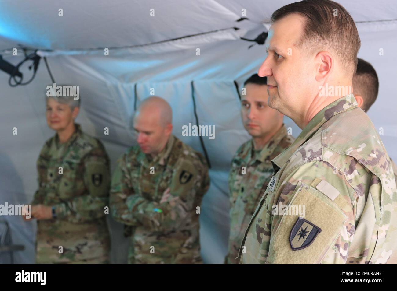 Col. Matthew J. Grieser (right), the commander of 1st Area Medical ...
