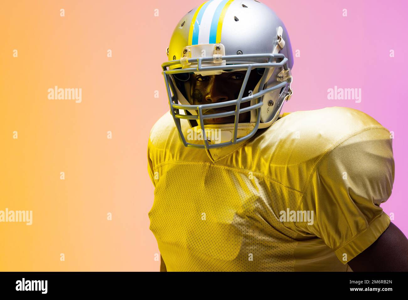 African american male american football player wearing helmet with neon ...