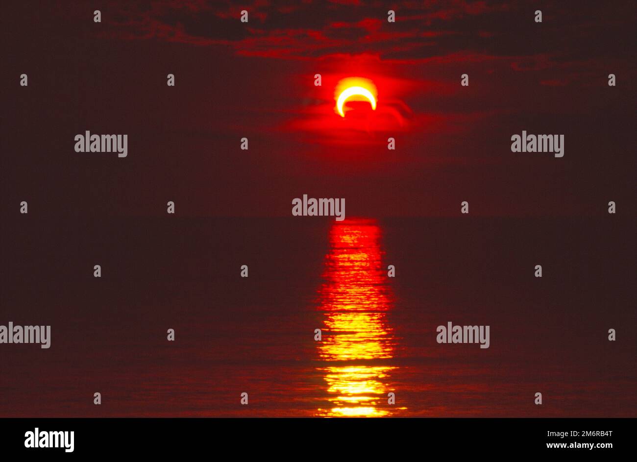 Solar eclipse over the ocean Stock Photo - Alamy