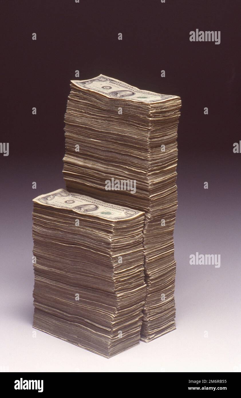 Two large stacks of American paper currency dollar bills Stock Photo ...