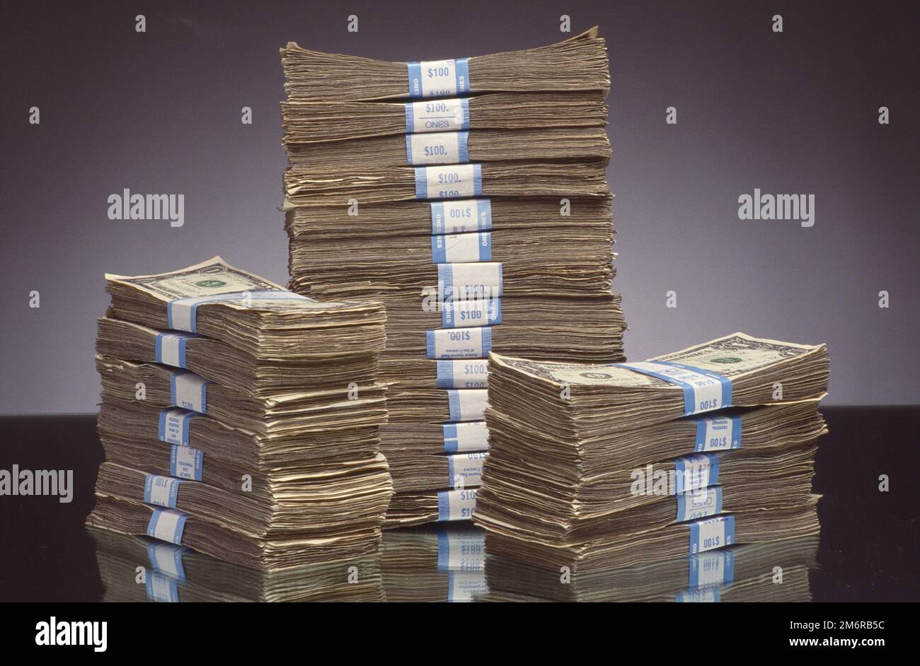 Stacks of US currency dollar bills wrapped in bunches Stock Photo - Alamy