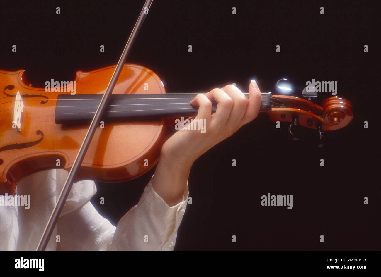 Close-up of Someone playing a violin Stock Photo - Alamy