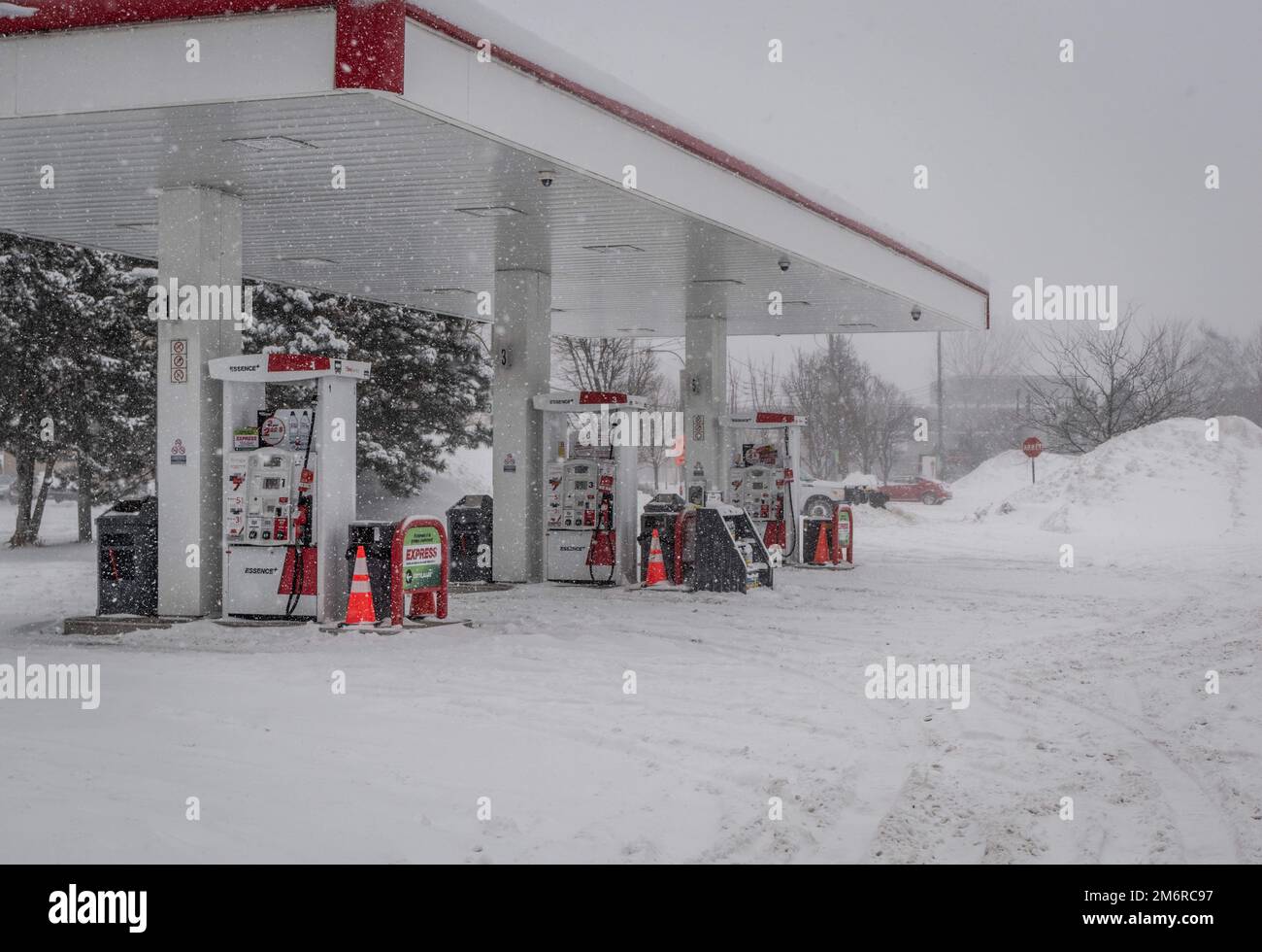 Petrol station under the snow. Impossibility to take a vehicle. Snow storm. Transport not ...