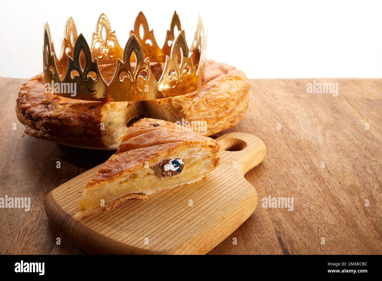 King cake or galette des rois in French. Epiphany pie with golden paper ...
