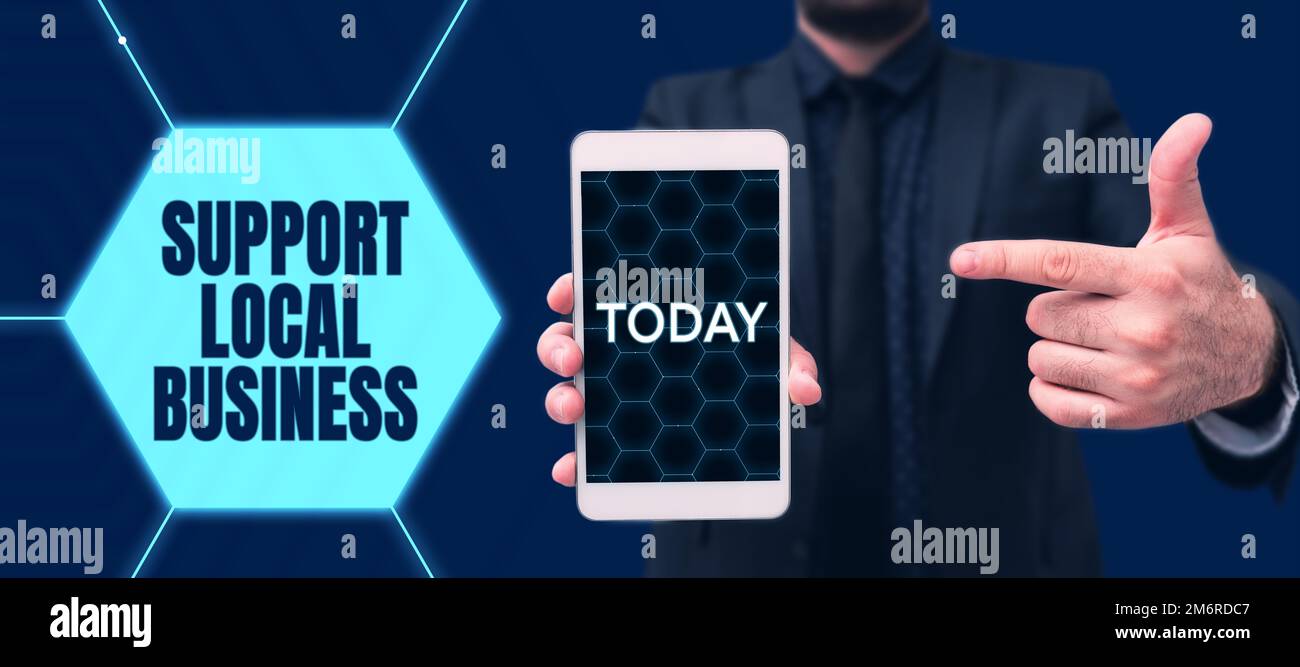 Sign displaying Support Local Business. Business idea increase ...