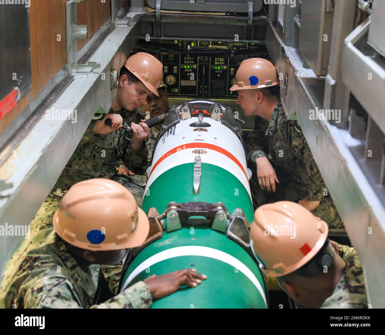 APRA HARBOR, Guam -- Sailors assigned to the Los Angeles-class fast ...