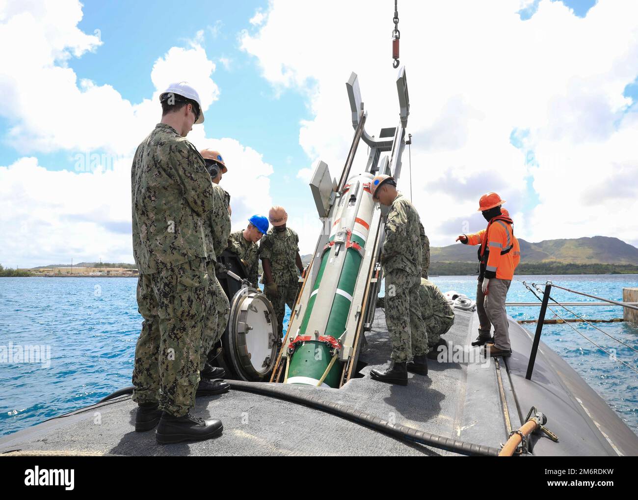 APRA HARBOR, Guam -- Sailors assigned to the Los Angeles-class fast ...