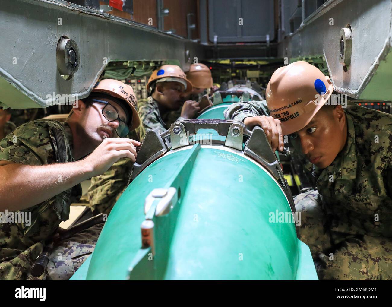 APRA HARBOR, Guam -- Sailors assigned to the Los Angeles-class fast ...