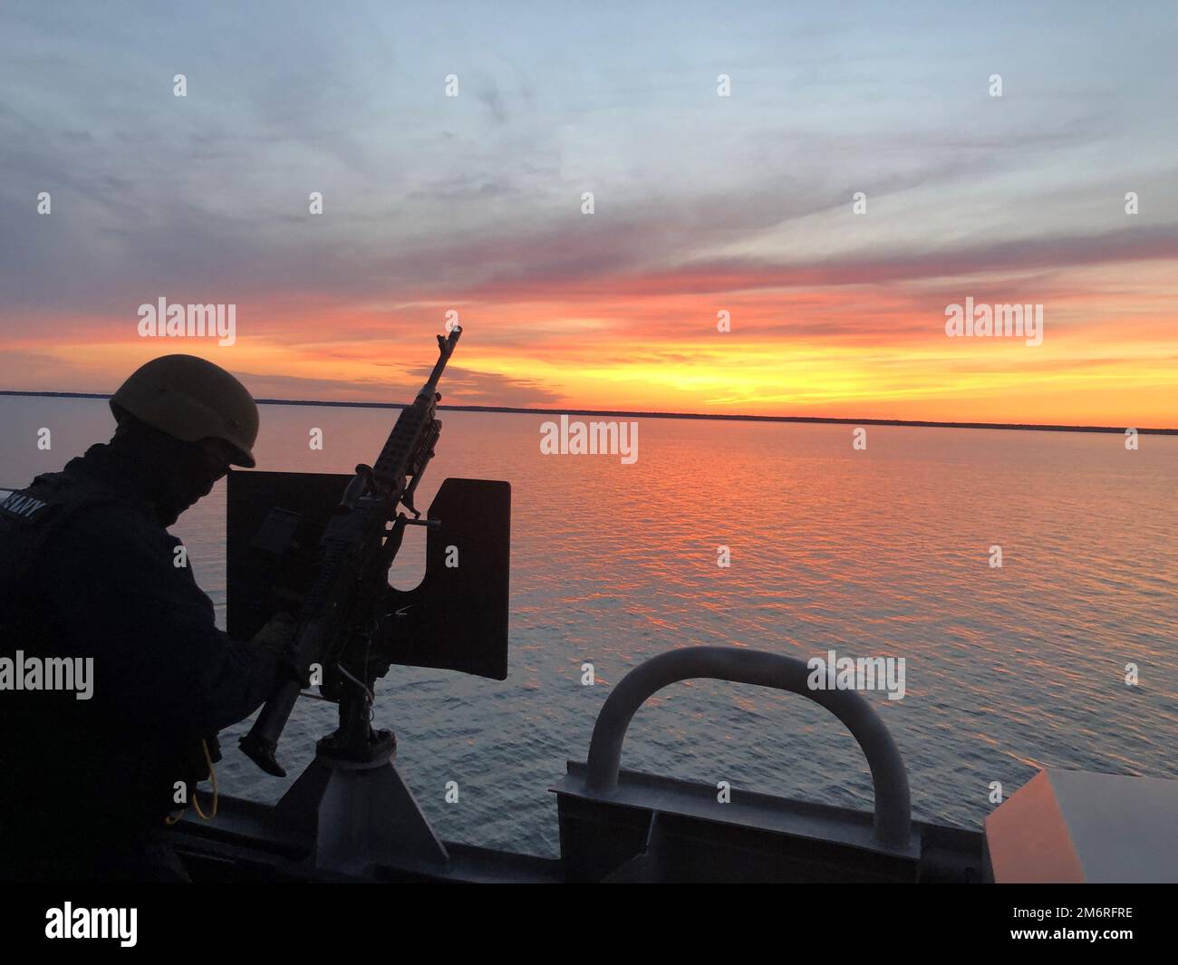 A Sailor strikes down the .50 cal crew served weapon as PCU Minneapolis ...