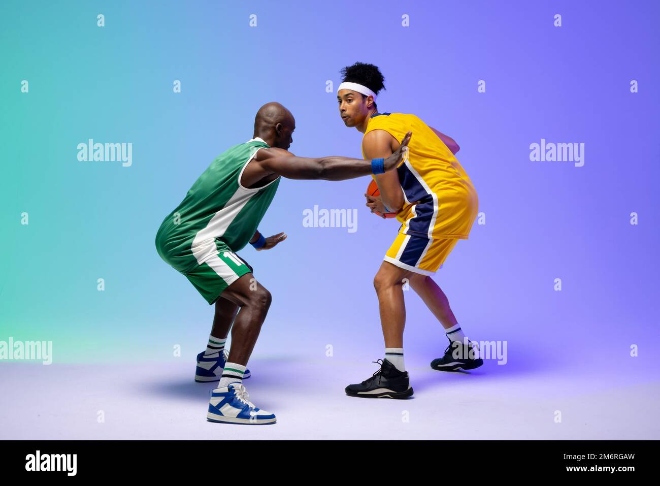 Image of two diverse basketball players with basketball playing on ...