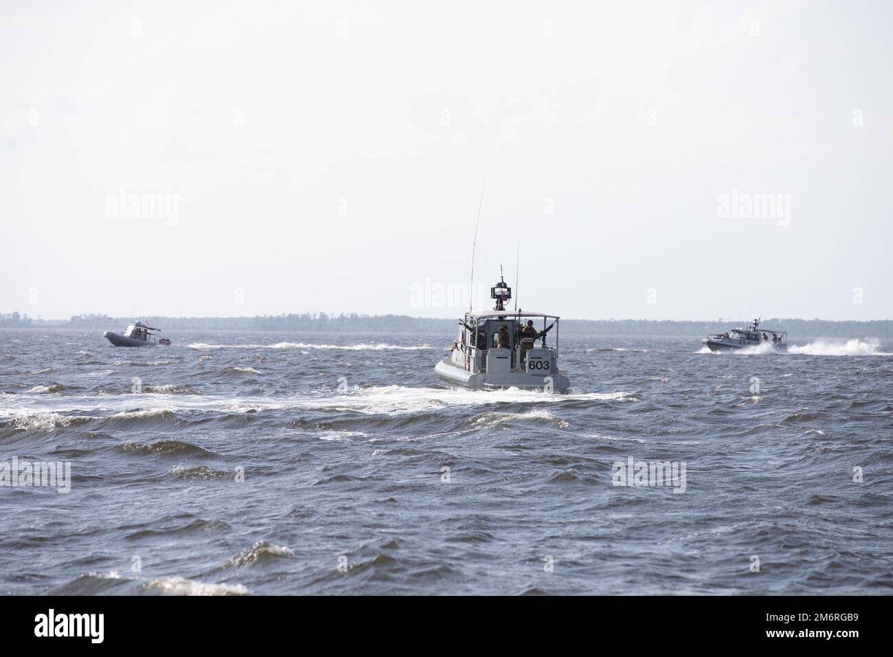 U.S. Navy patrol boats assigned to Maritime Expeditionary Security ...