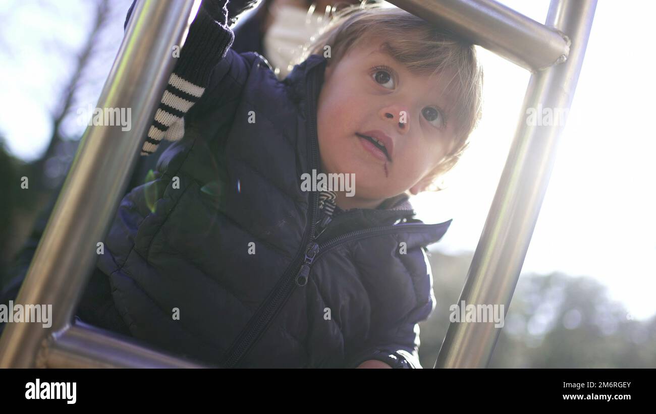 Active Little toddler boy climbing playground staircase outside in ...