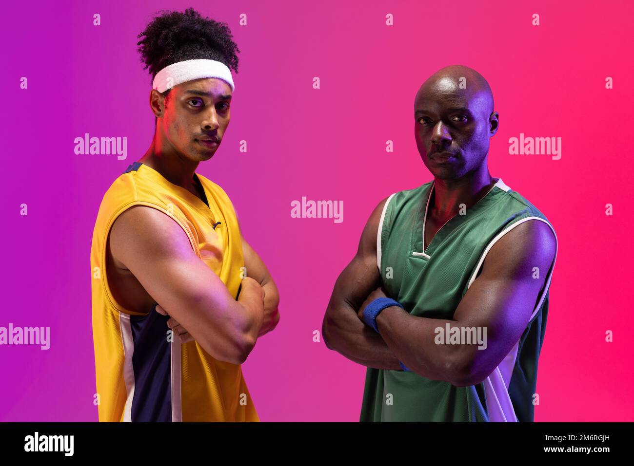 Image of portrait of two diverse basketball players facing each other ...
