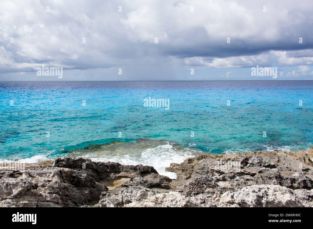 The scenic view of Half Moon Cay island turquoise color waters and dark ...