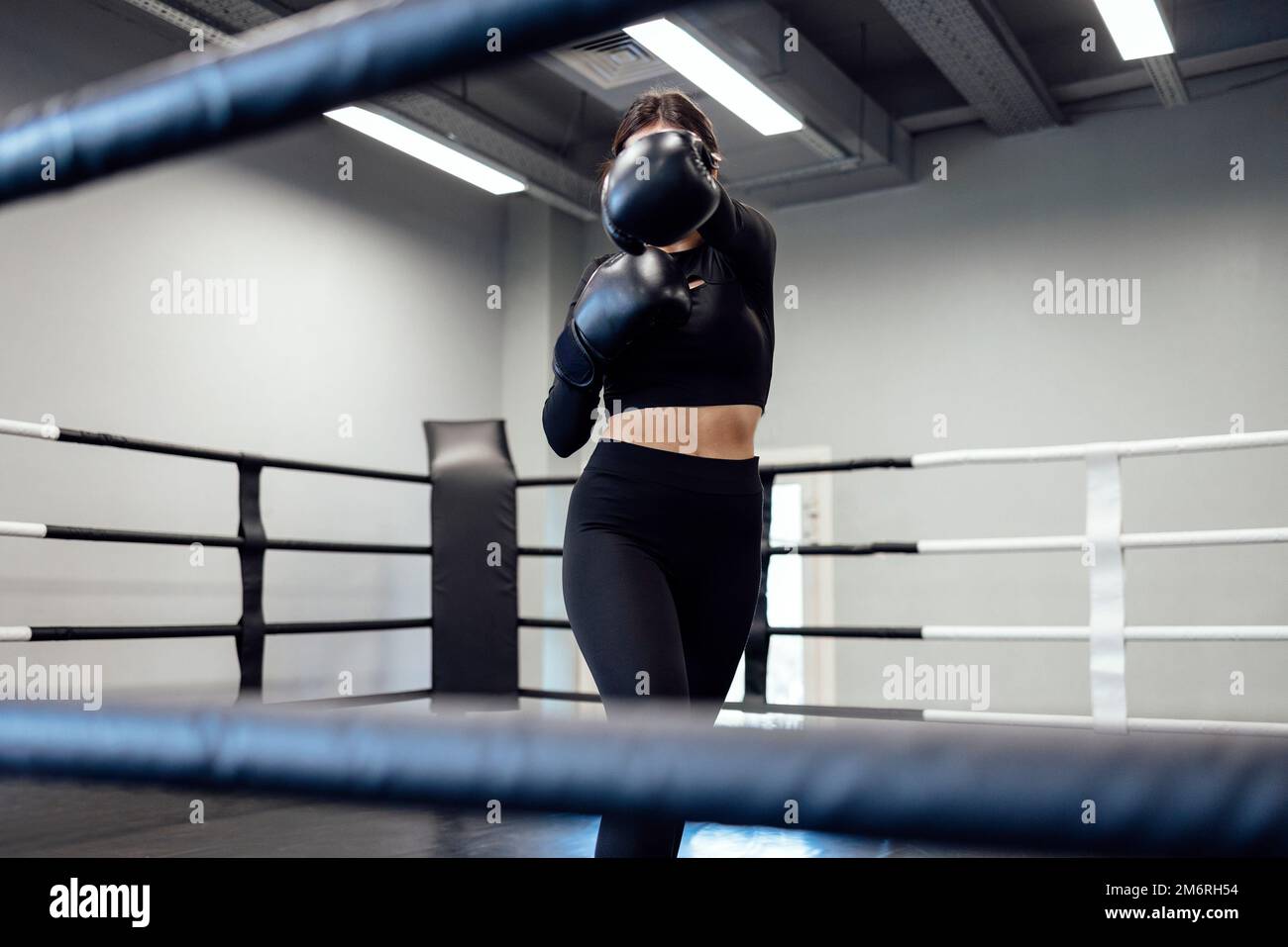 Strong latin boxing woman on the ring at fitness gym. Athletic girl ...