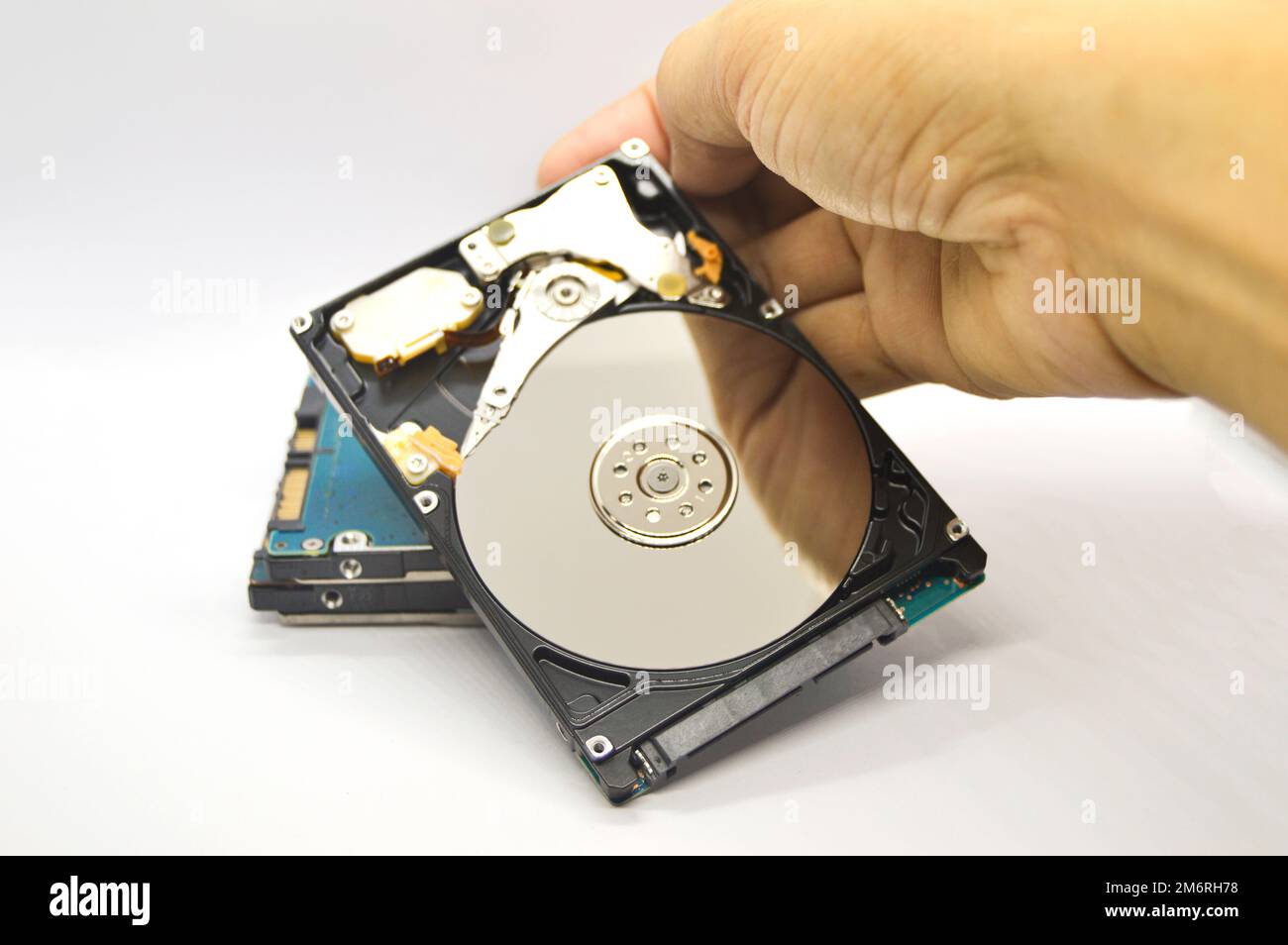 2.5-inch spinning disk type hard drive images are still commonly used ...