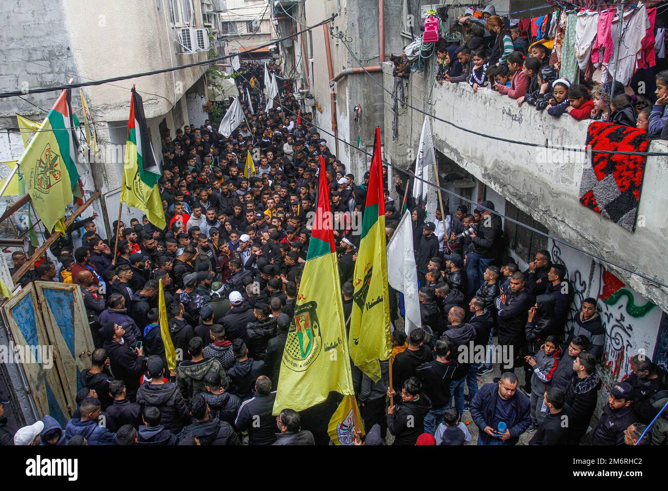 Nablus, Palestine. 05th Jan, 2023. Mourners and armed men carry the ...