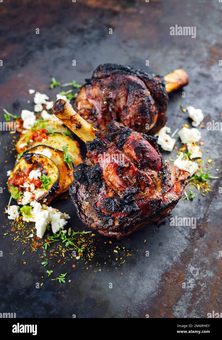 Traditional Greek barbecue lamb shank with vegetable briam served as ...