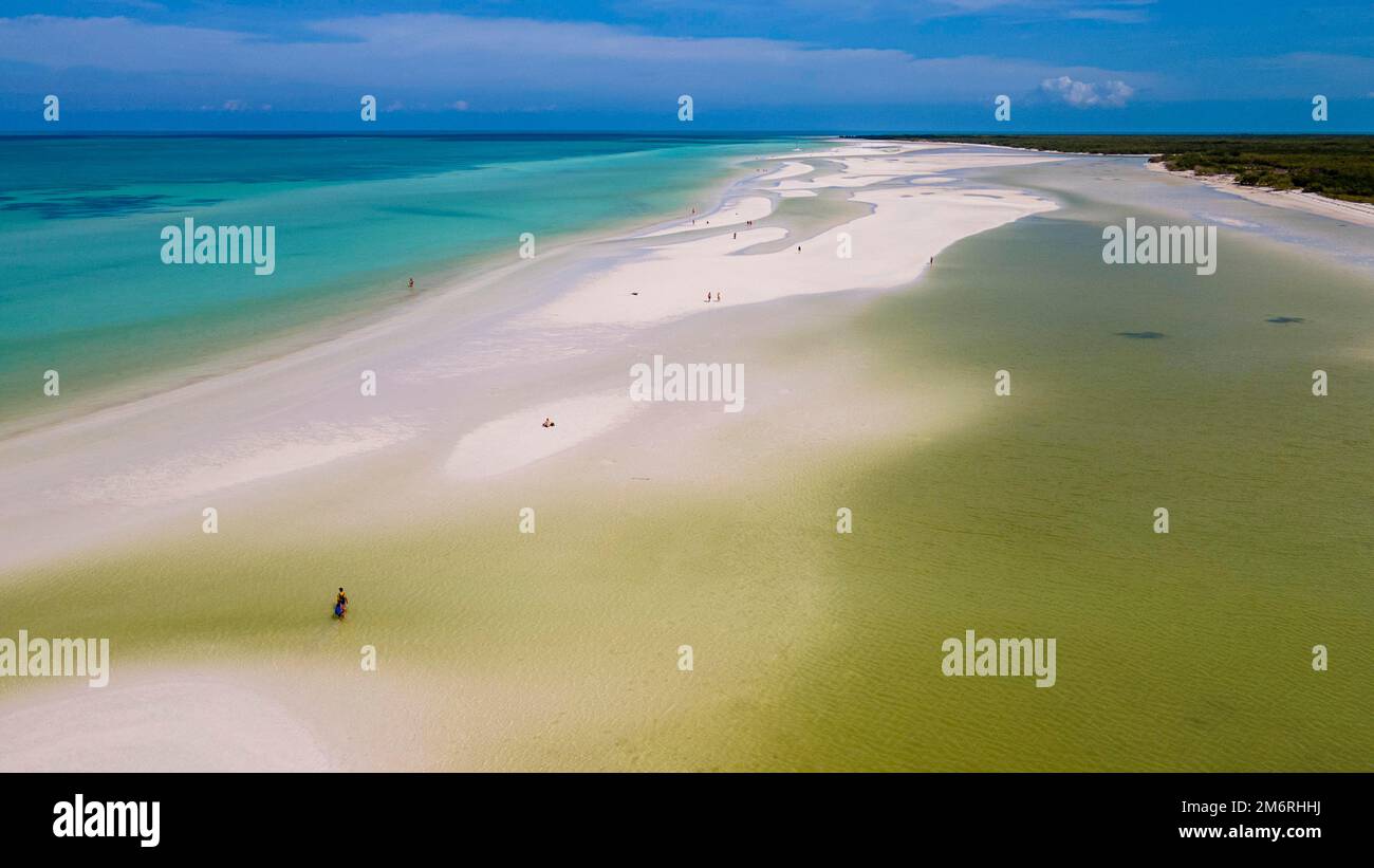 Aerial of the turquoise waters and white sands of Holbox island ...