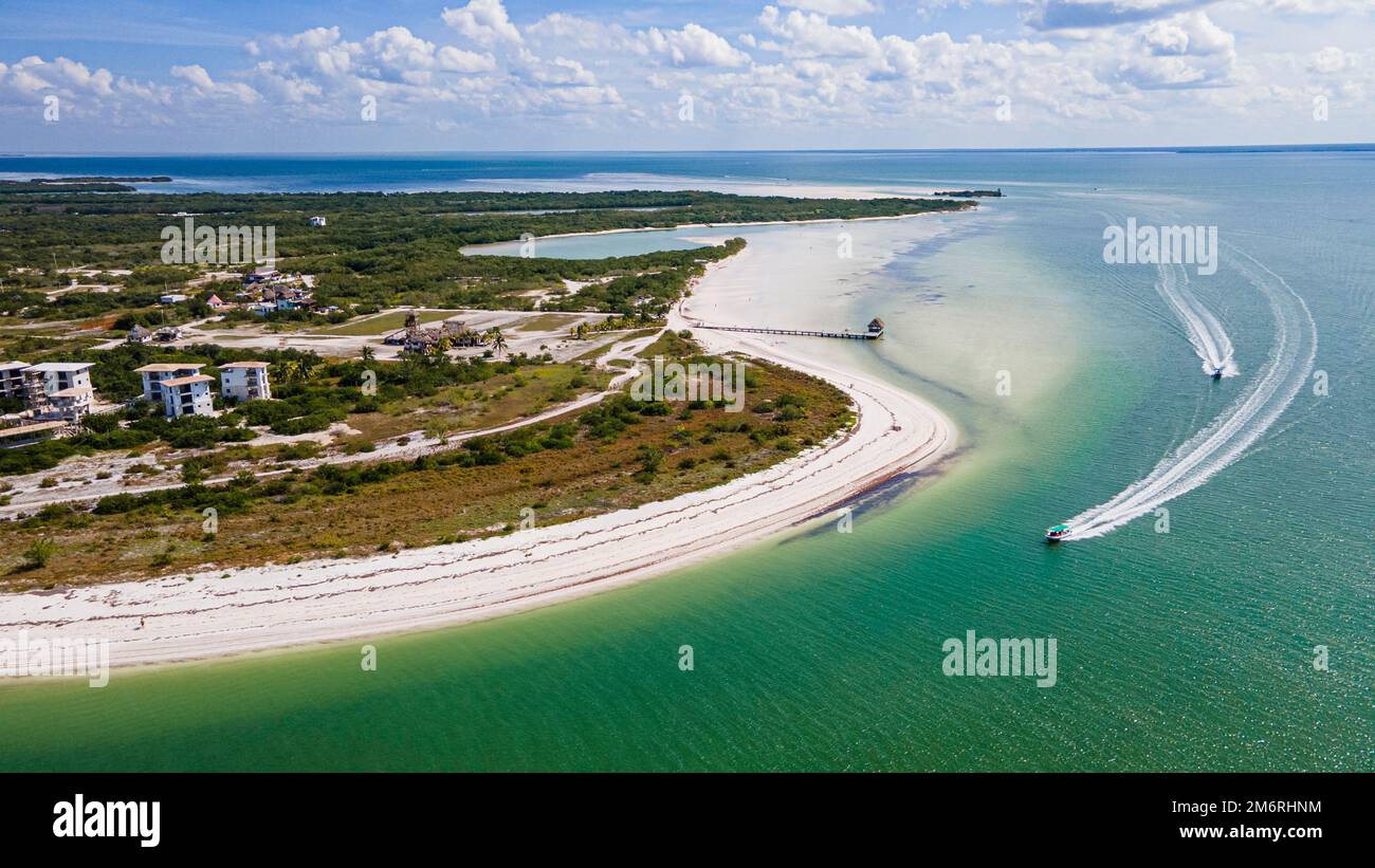 Aerial of the turquoise waters and white sands of Holbox island ...