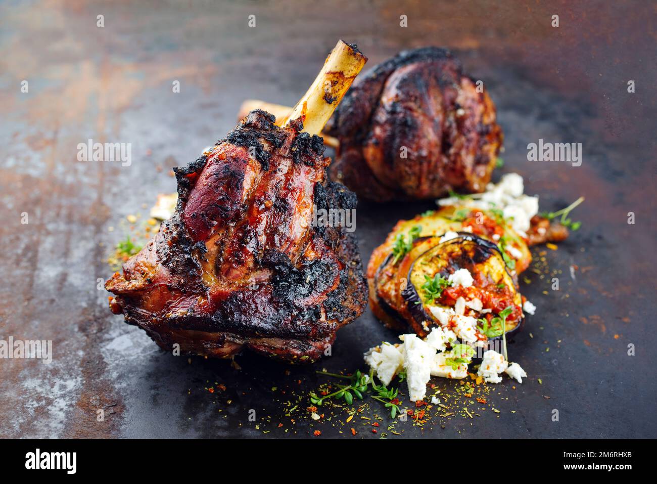 Traditional Greek barbecue lamb shank with vegetable briam served as ...