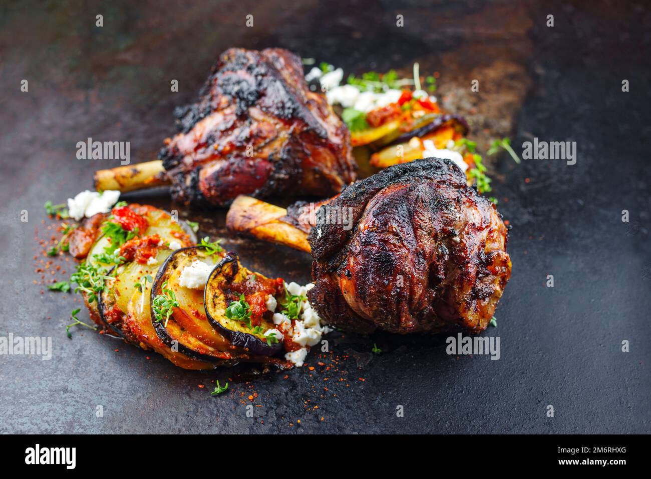 Traditional Greek barbecue lamb shank with vegetable briam served as ...