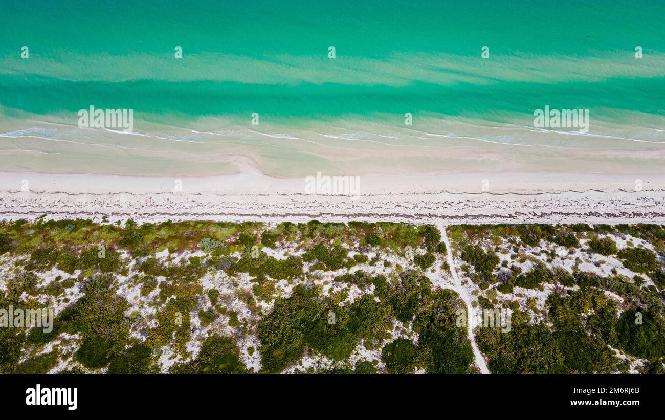 Aerial of the white sand beach and turquoise waters of Las Coloradas ...