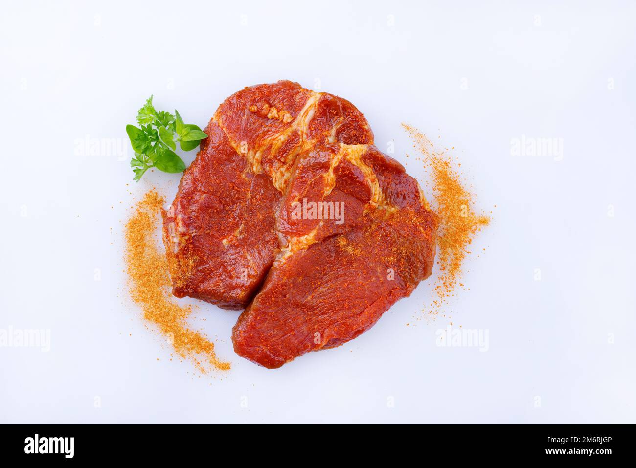 Traditional raw seasoned pork neck steak prepared for a summer barbecue ...