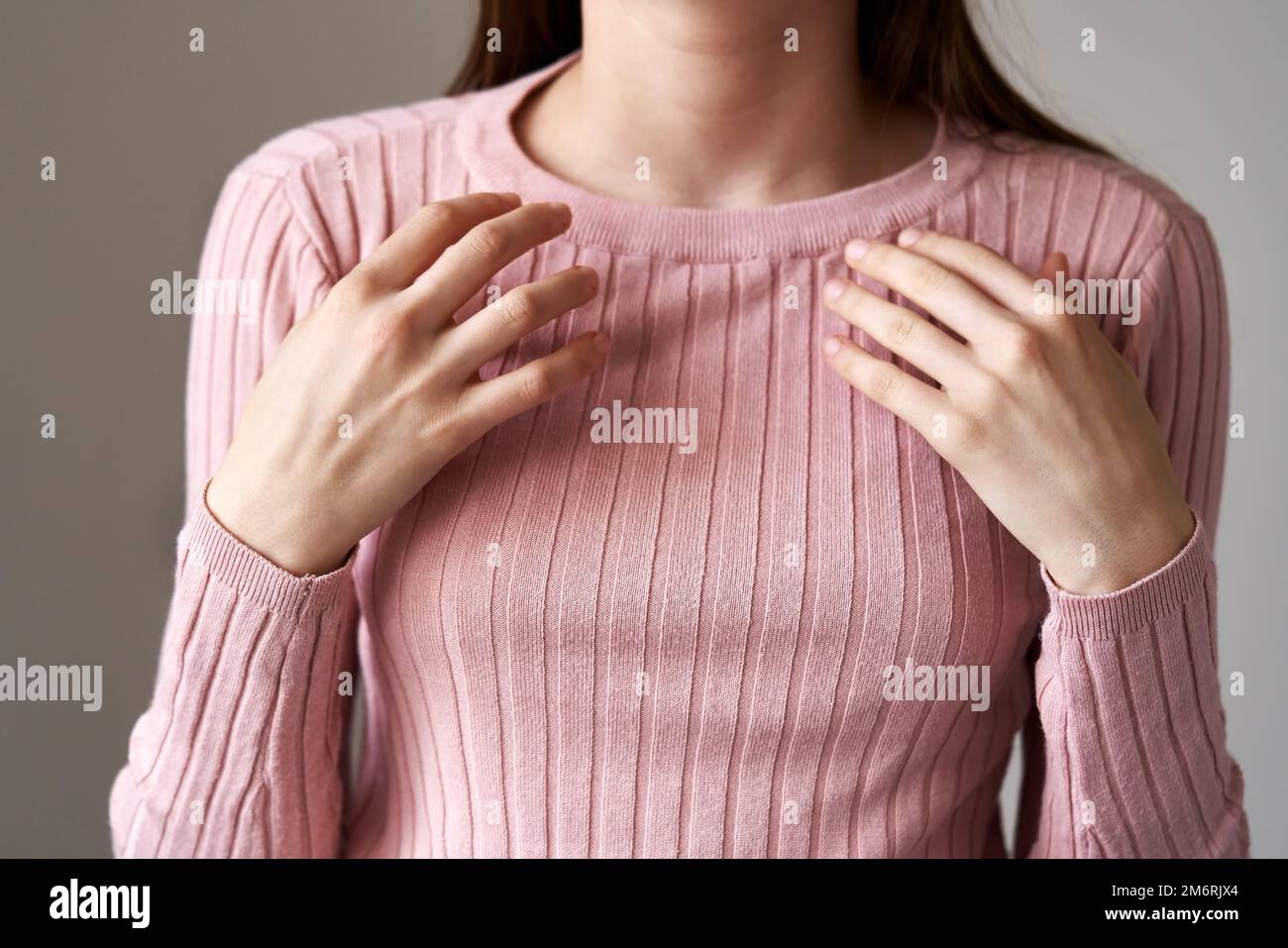 Teenage girl practicing EFT or emotional freedom technique - tapping on ...