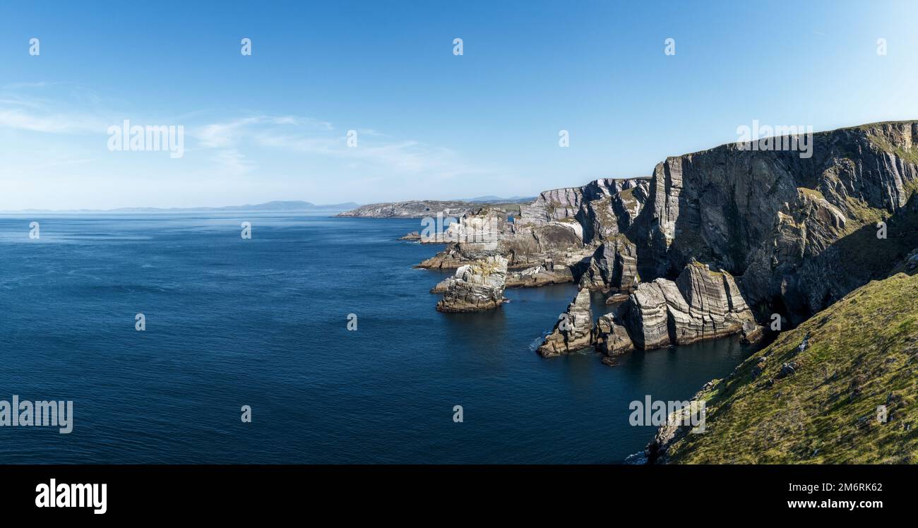 Panorama view of the cliffs and rugged coastline of the Mizen Peninsula ...