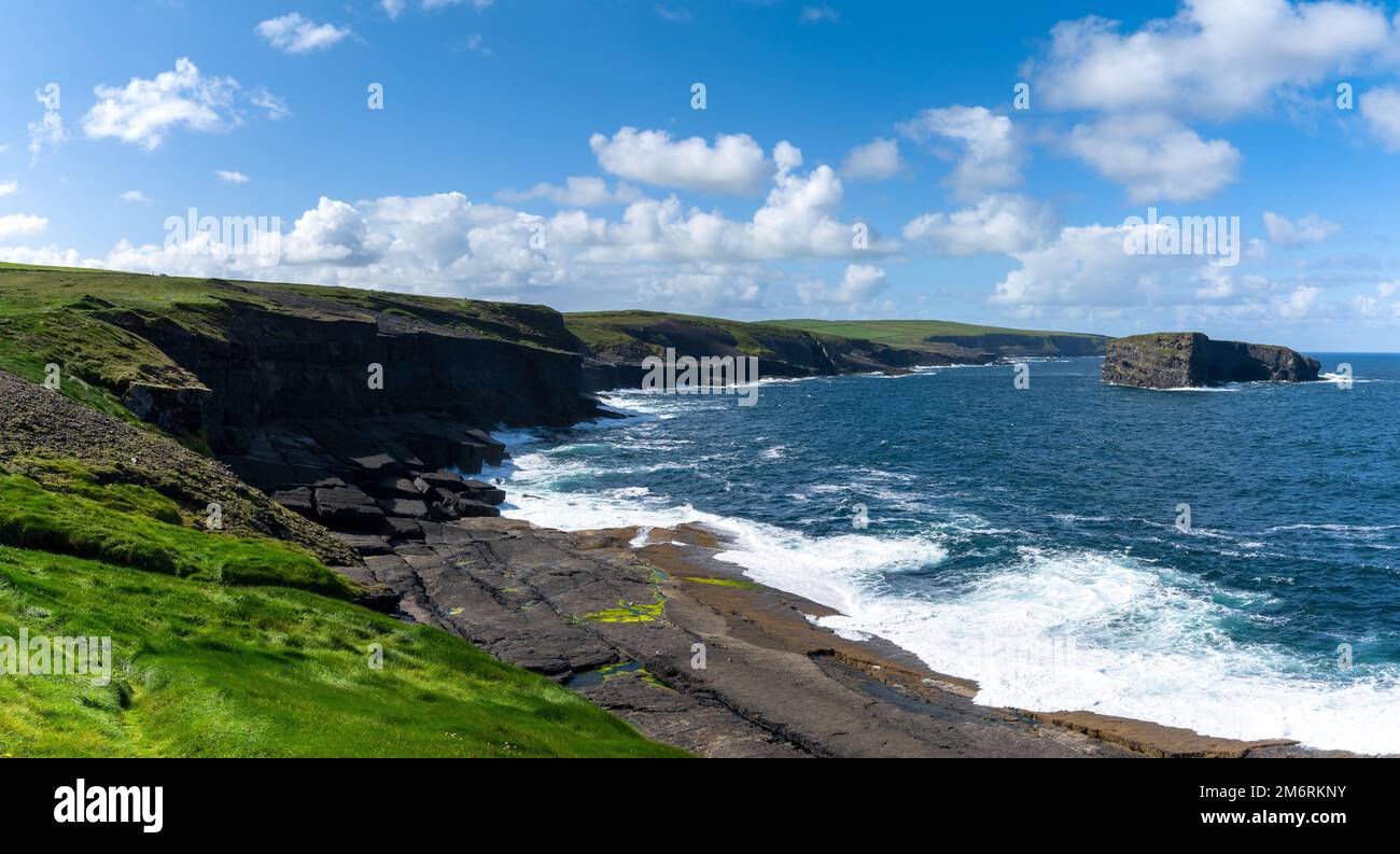 A panorama view of the rugged coastline and Kilkee Cliffs in western ...
