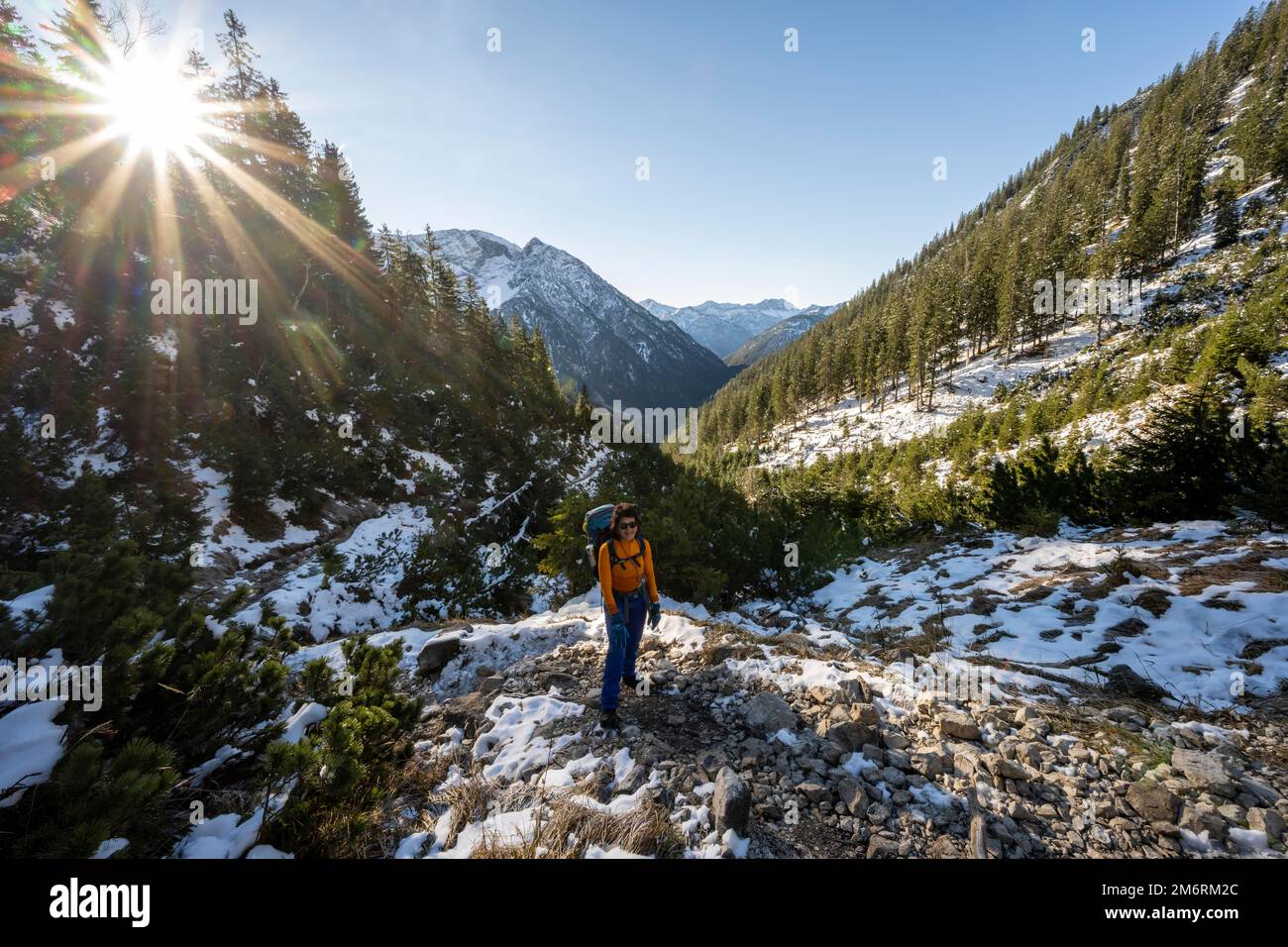 Hikers on a hiking trail in winter, path to Ammergauer Hochplatte ...