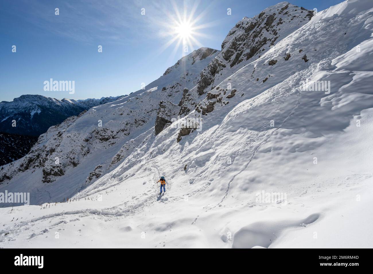 Mountaineer on hiking trail in winter with snow, path to Ammergauer ...