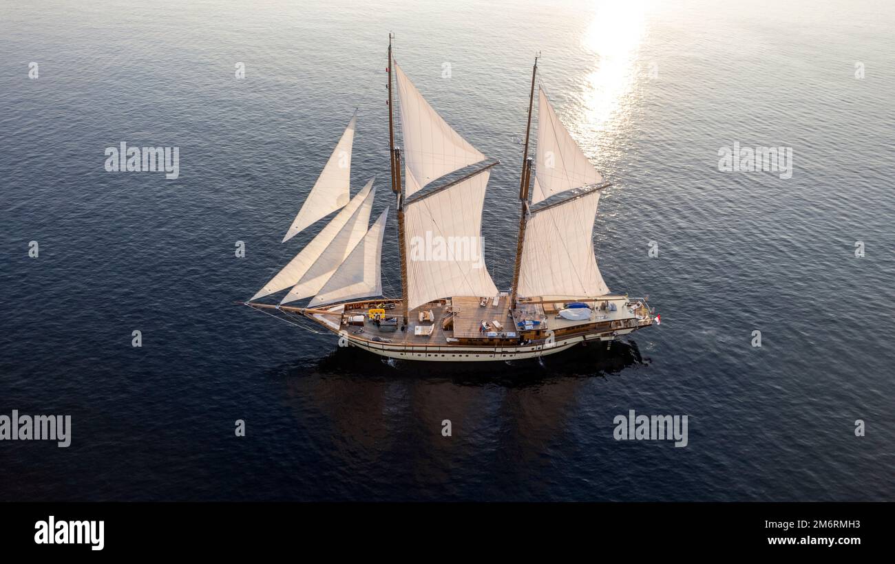 Aerial view of a sailing boat in Dampier Strait, Raja Ampat Indonesia ...